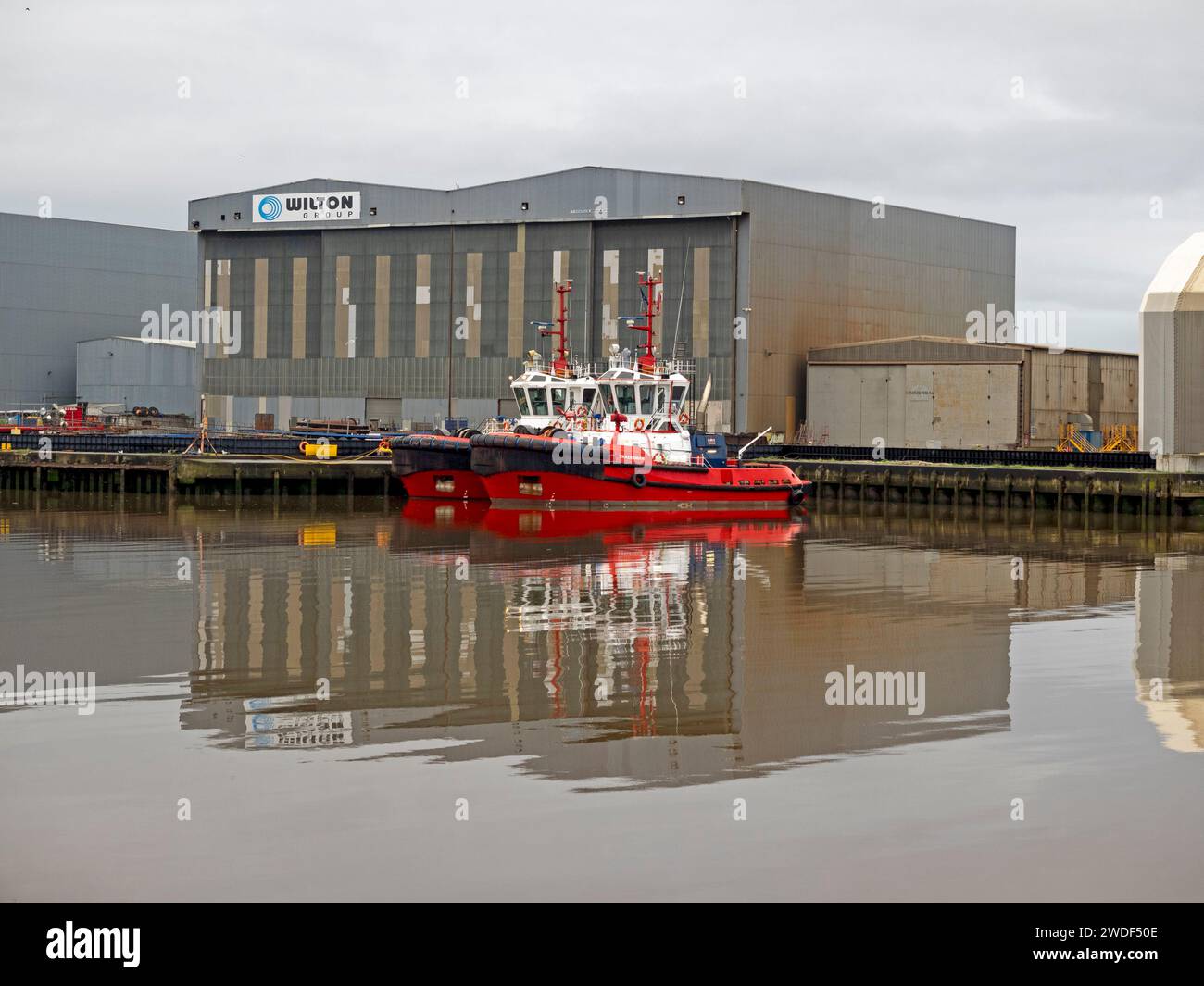 Two Harbour tugs moored outside the Wilton Fabrication Works on the ...
