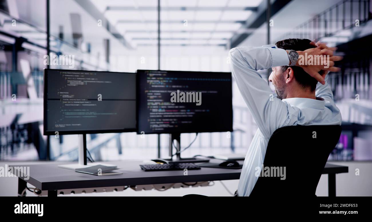Happy Excited Male Programmer Raising Arms In Office Stock Photo - Alamy