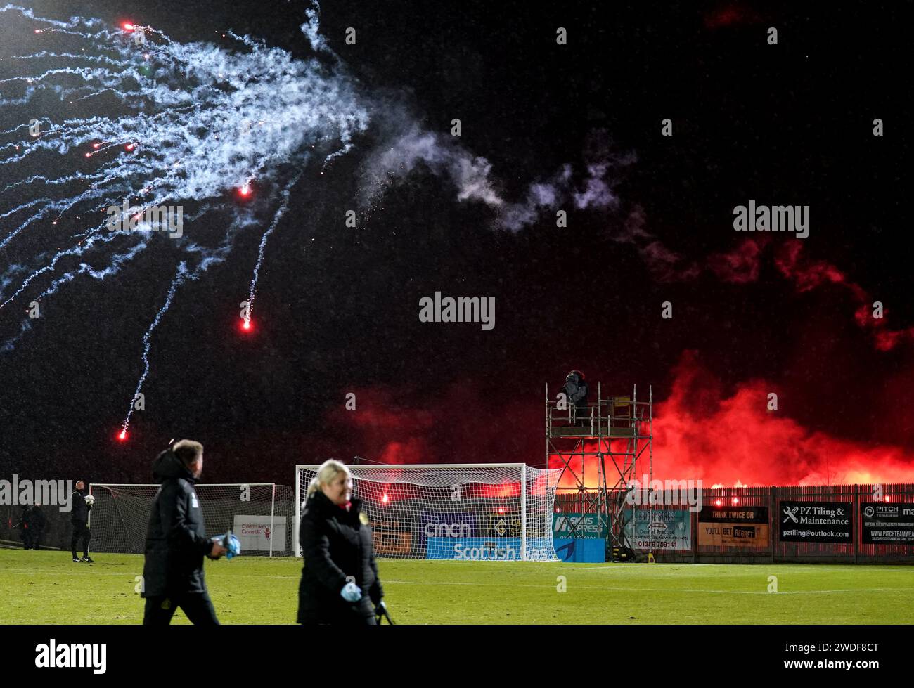 Fireworks and smoke flares go off outside of the stadium ahead of the ...