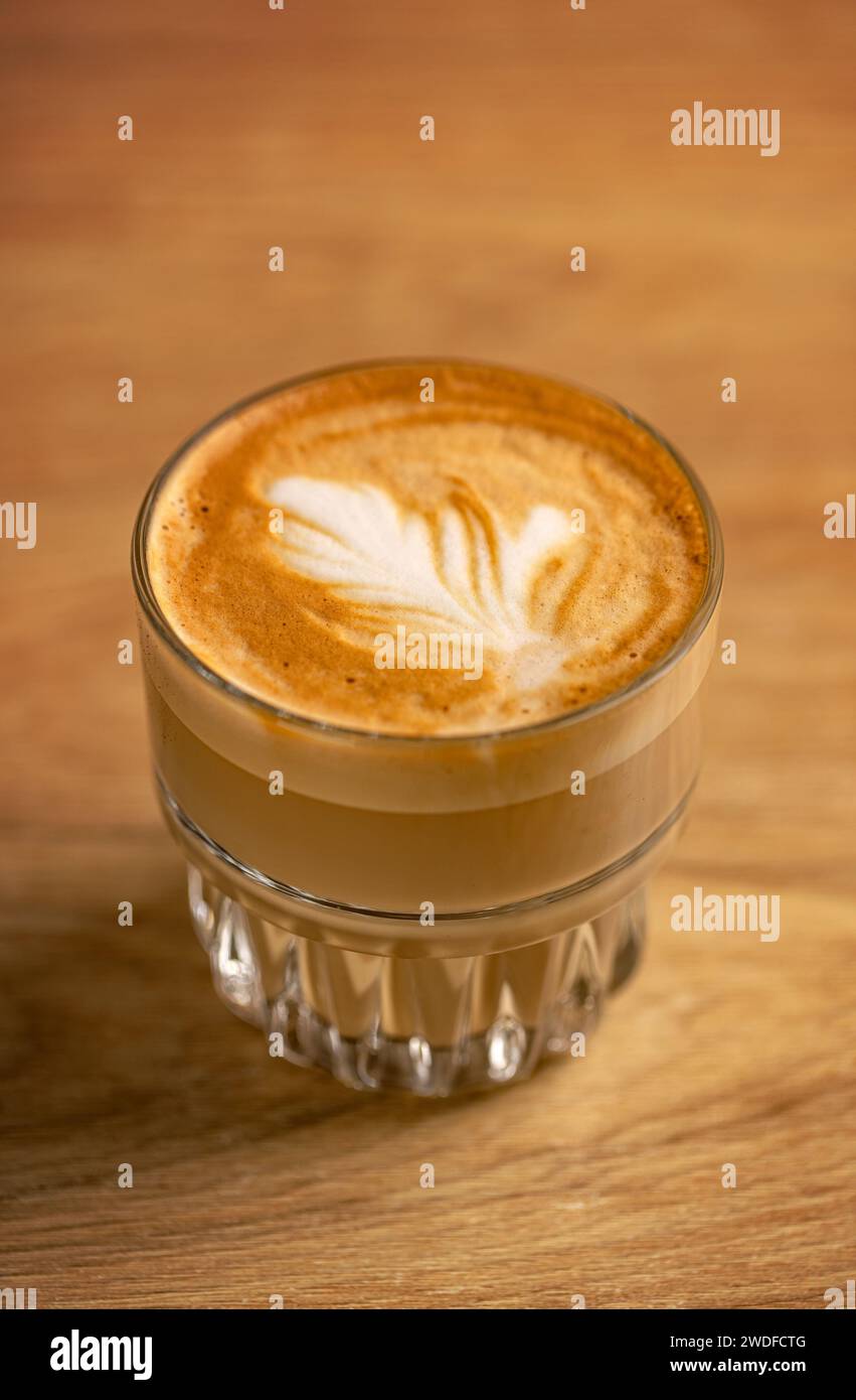 Hot latte coffee drink in glass with cream milk Stock Photo - Alamy