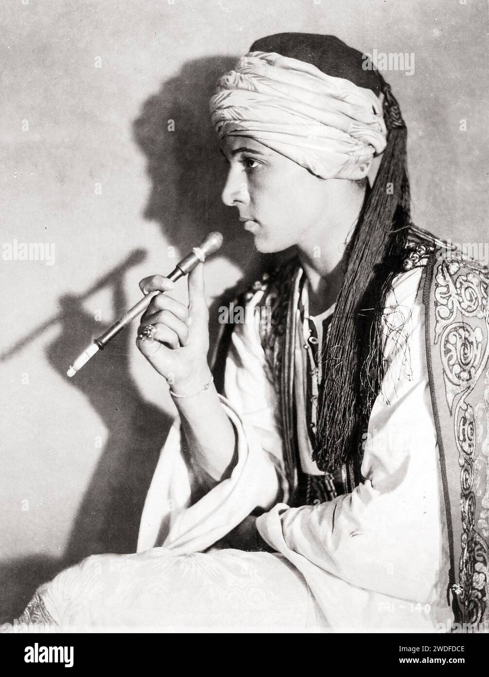 Rudolph Valentino in The Sheik - smoking and with turban, 1921 Stock ...