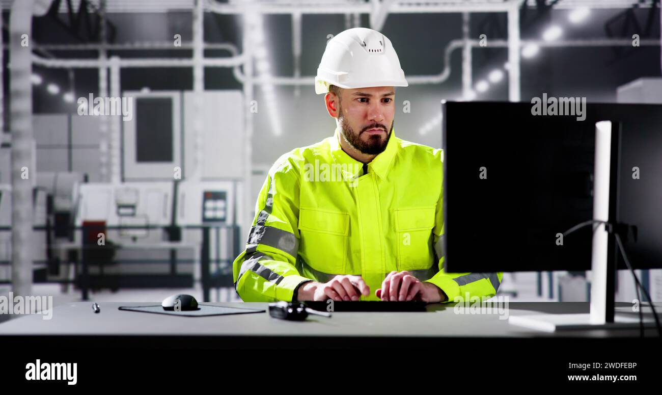 Engineer Using PC In Automated Semiconductor Assembly Line Stock Photo ...