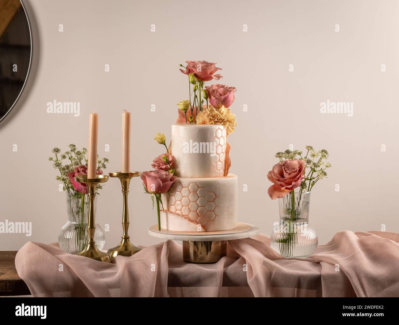 Beautiful wedding cake decorated with peach fuzz colored flowers Stock ...