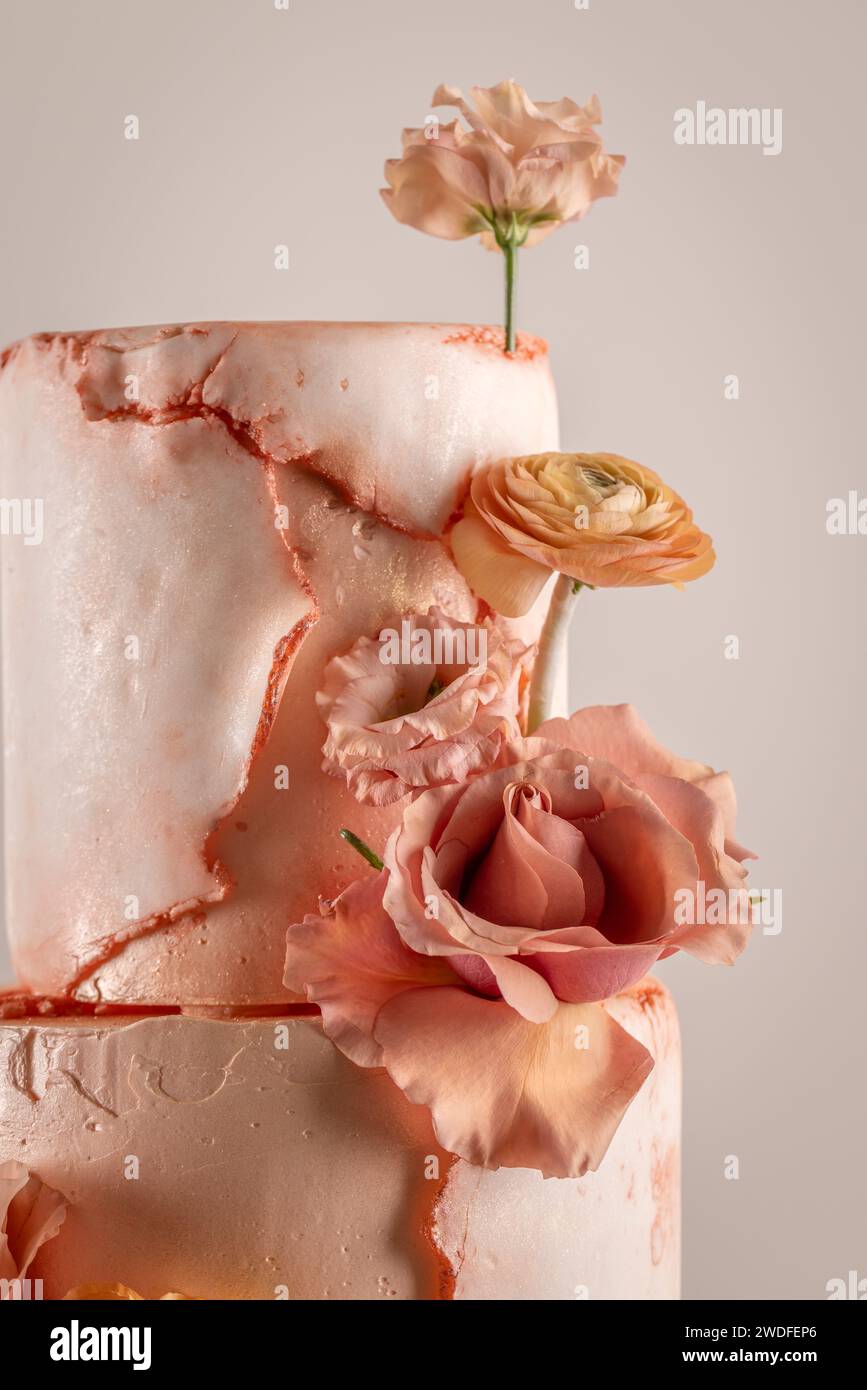 Close up of beautiful wedding cake with peach fuzz colored flower Stock ...