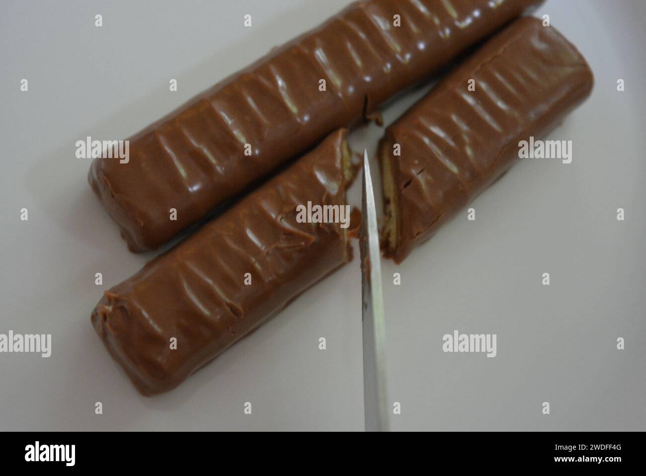 Sweets, knife-cut sticks covered with milk chocolate, shortbread liver ...