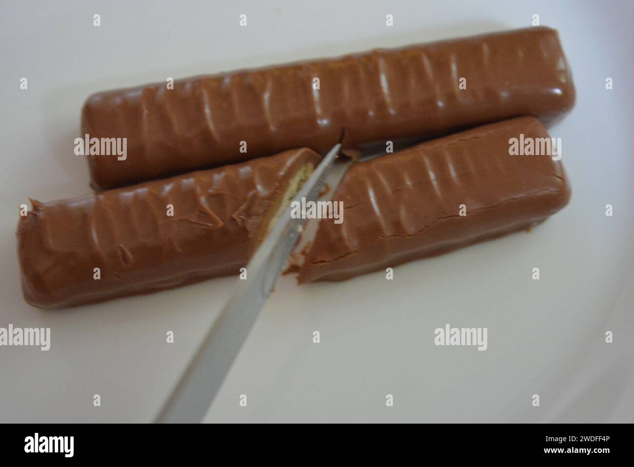 Sweets, knife-cut sticks covered with milk chocolate, shortbread liver ...