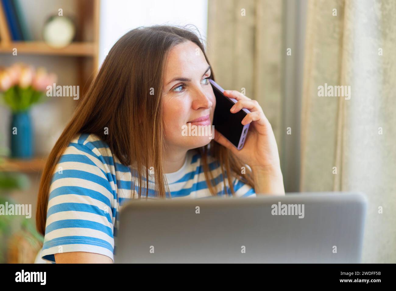 Woman Working from Home on a Phone Call Stock Photo - Alamy
