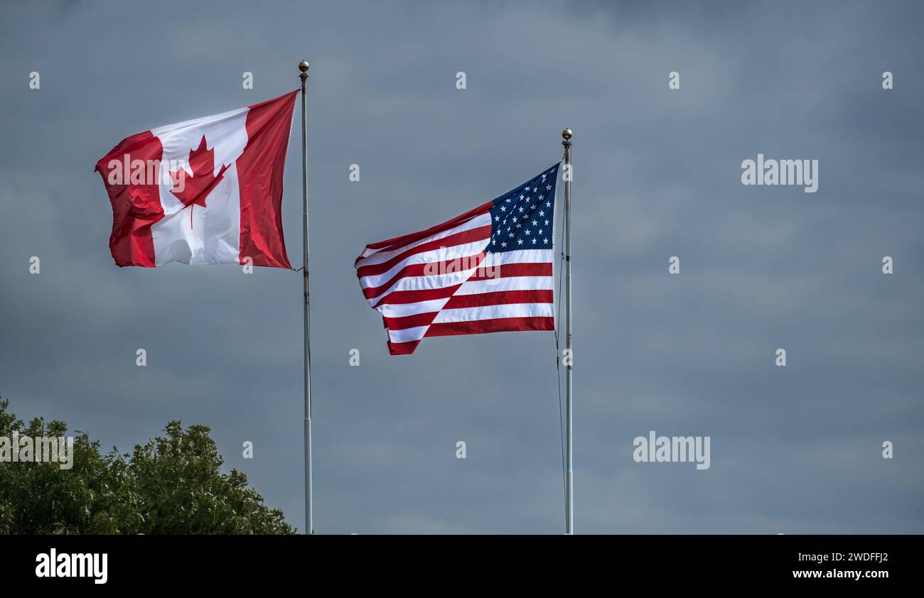 American and Canadian flags together. American and Canadian flags ...