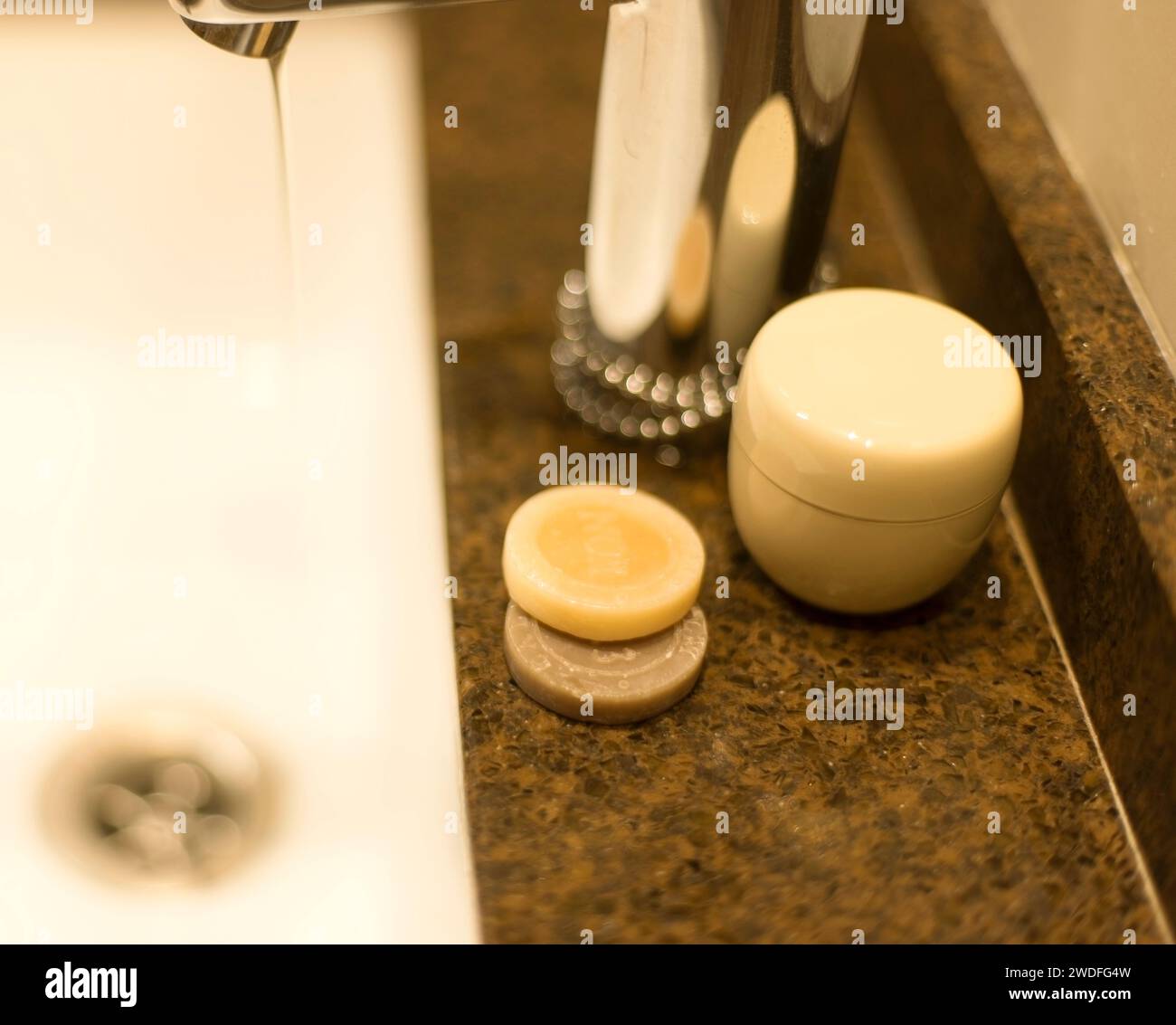 sink countertop with round soaps, france Stock Photo - Alamy
