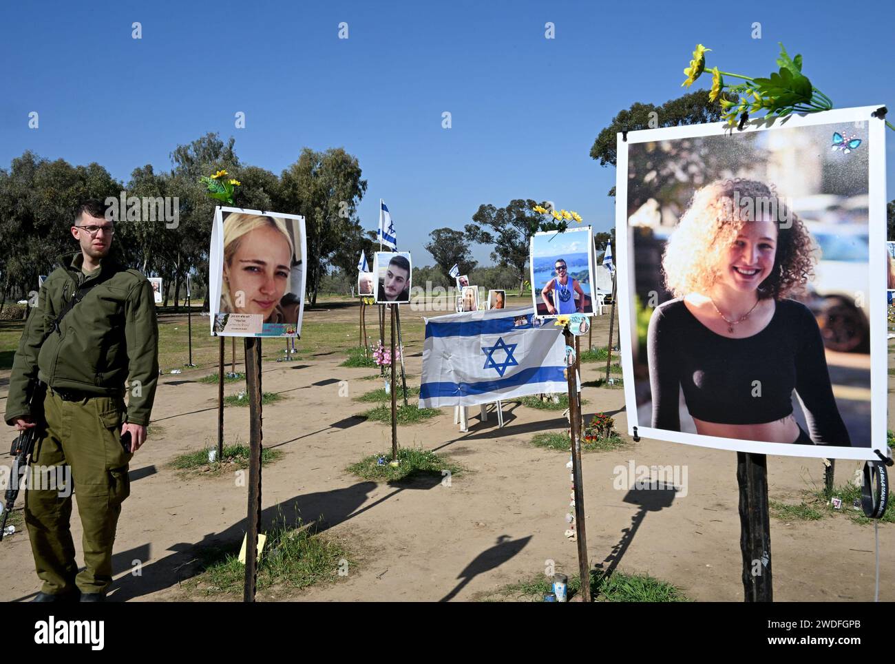 Reim, Israel. 20th Jan, 2024. An Israeli soldier walks by national ...