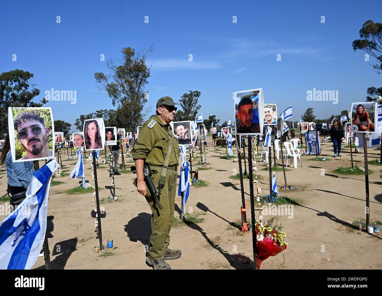 Reim, Israel. 20th Jan, 2024. An Israeli soldier pauses to look at ...