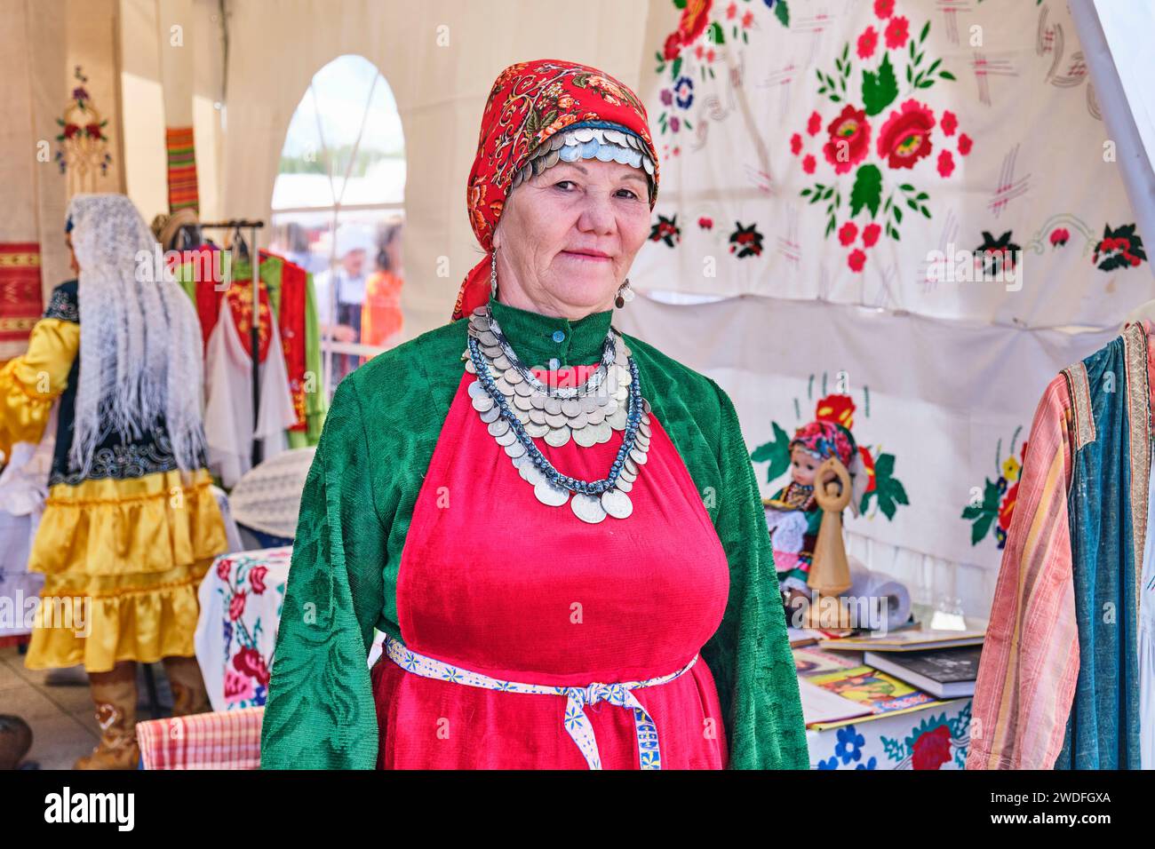 Portrait of senior woman in Mordovian national dress. Traditional Irbit ...