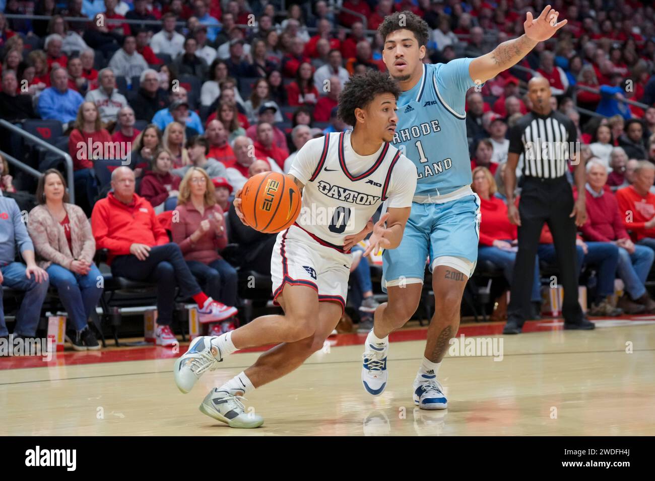 Dayton guard Javon Bennett (0) dribbles the ball around Rhode Island ...