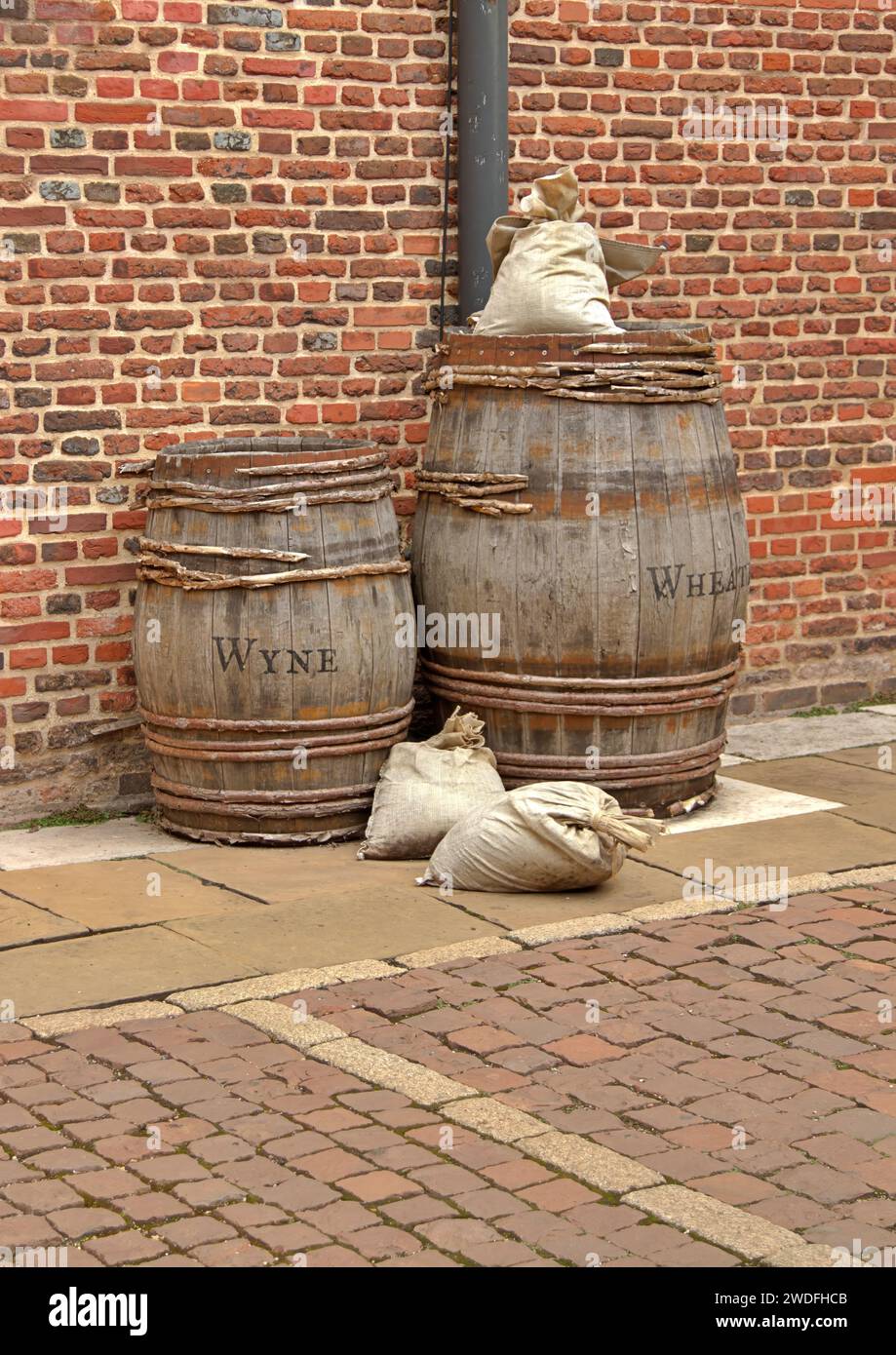 Old barrels of wheat and wine by an old brick wall Stock Photo - Alamy