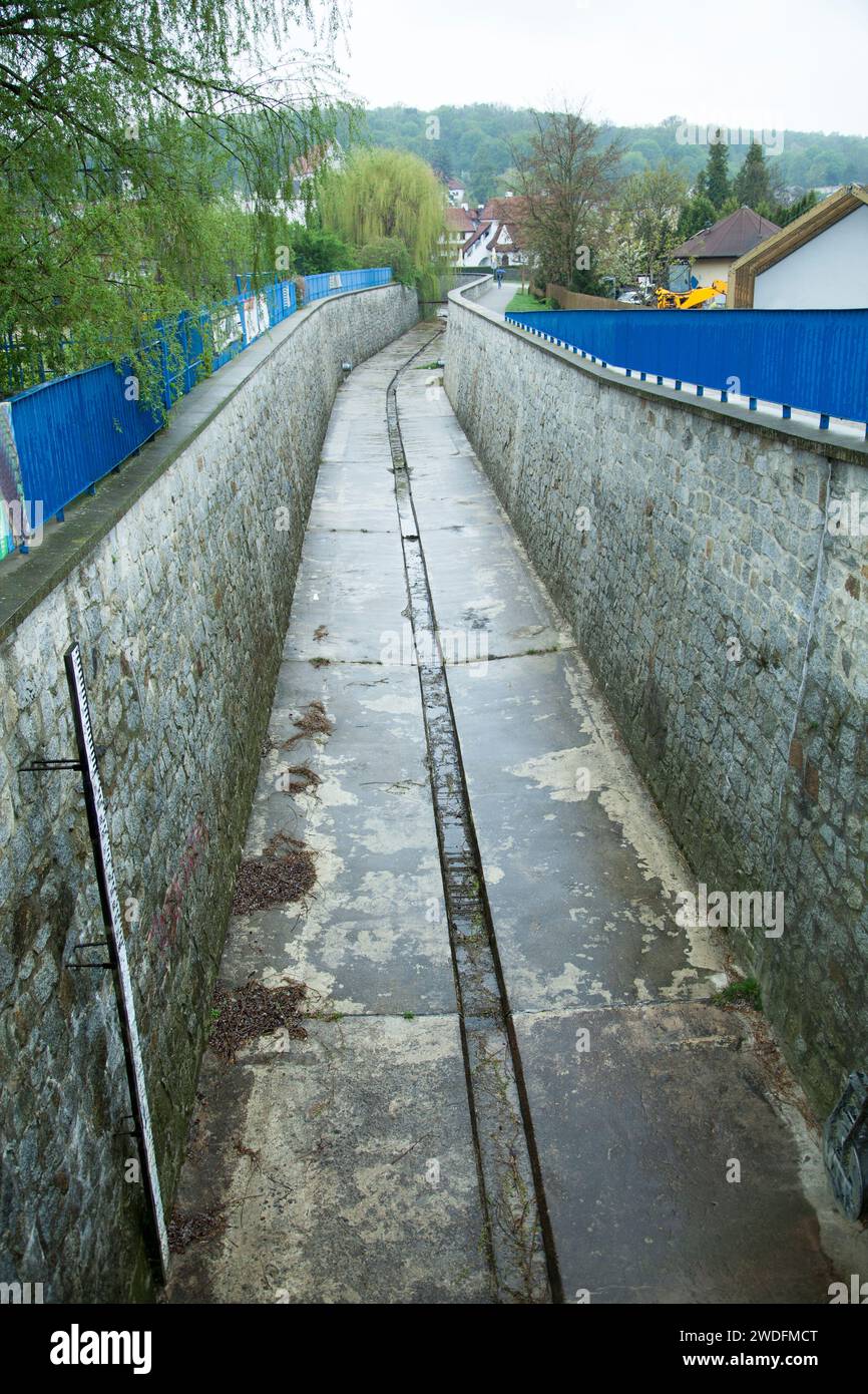 The view of Kazimierz Dolny town empty canal with a ruler to check the ...