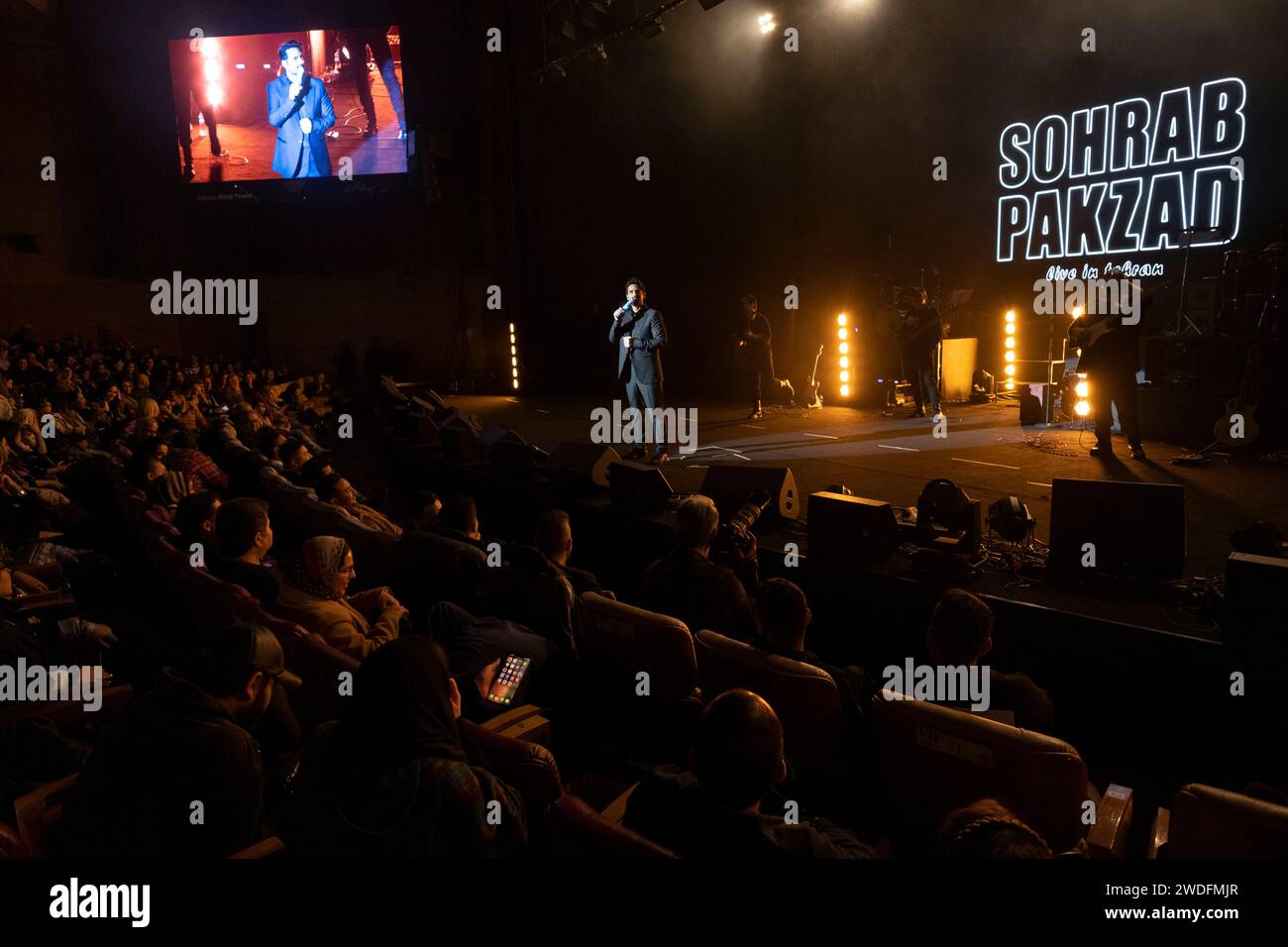 Tehran, Iran. 19th Jan, 2024. Iranian singer and composer Sohrab Pakzad (C) is speaking to his ...