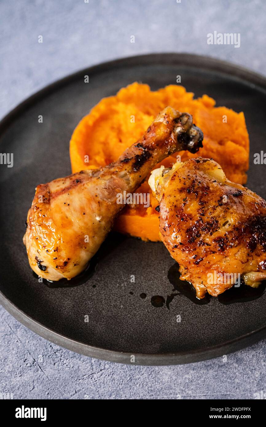 Lemon roasted chicken with sweet potato puree Stock Photo - Alamy