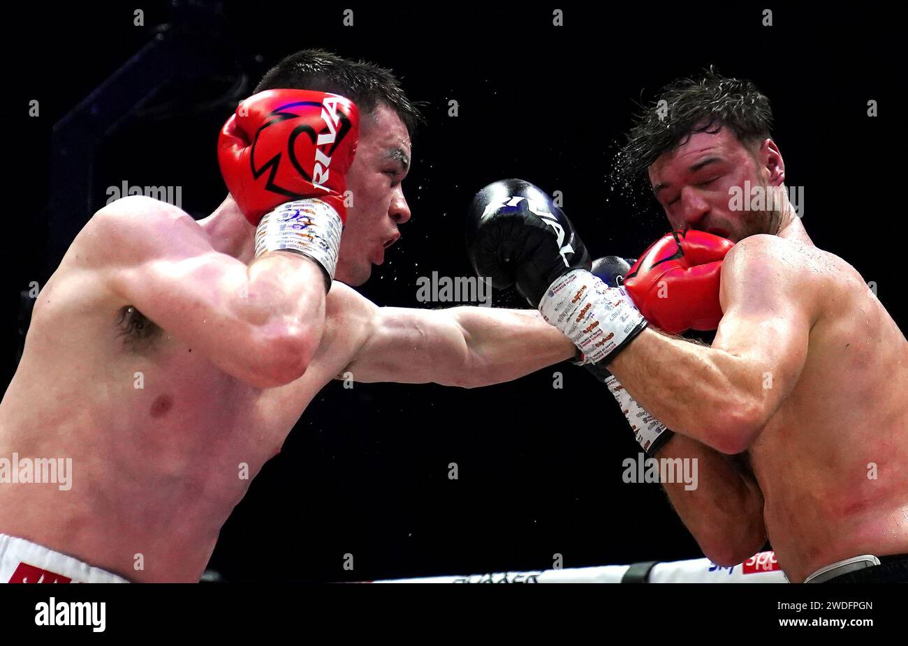 Aaron McKenna (left) strikes Mickey Ellison in the middleweight bout at ...