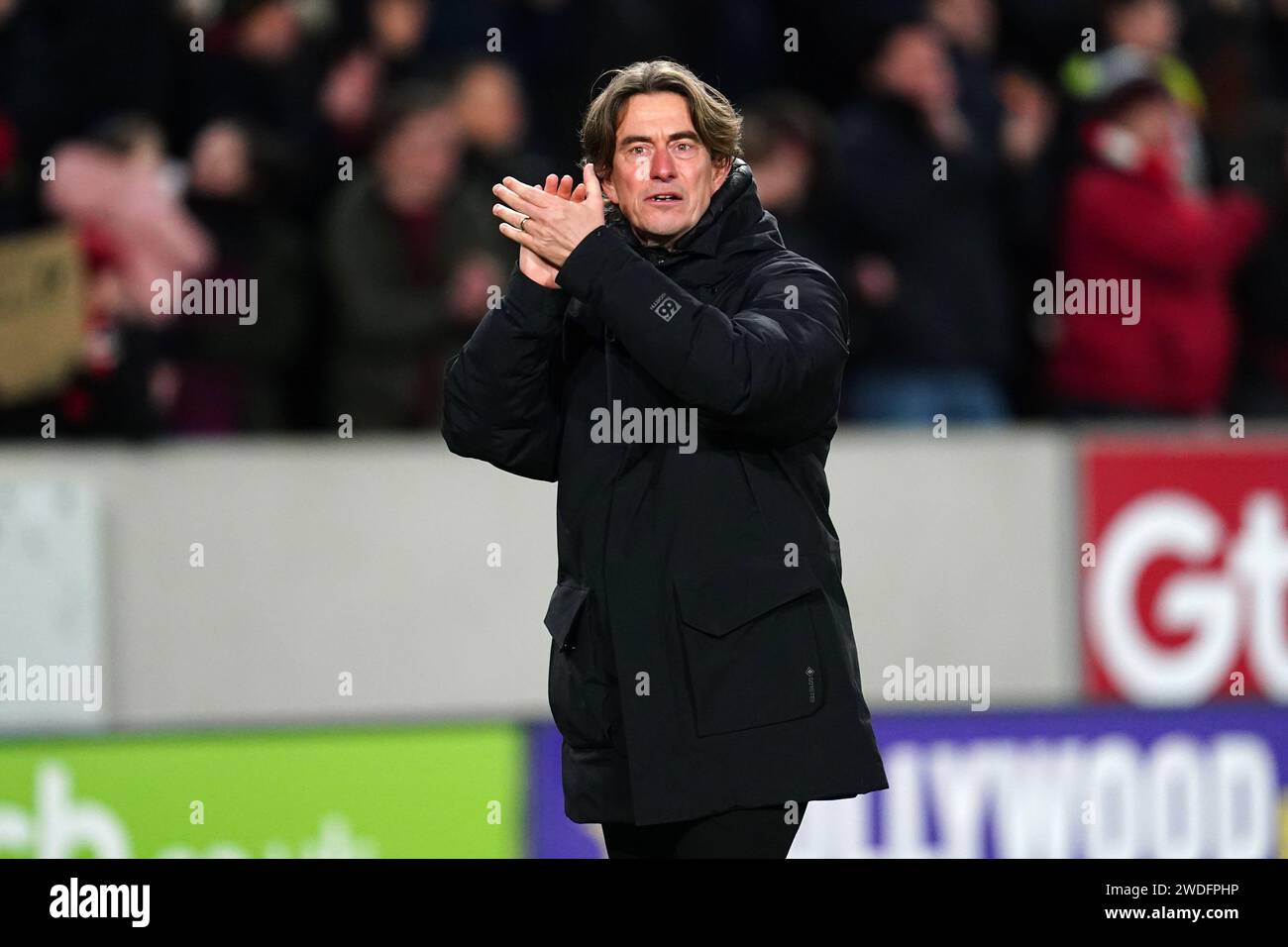 Brentford manager Thomas Frank applauds the fans following victory in ...