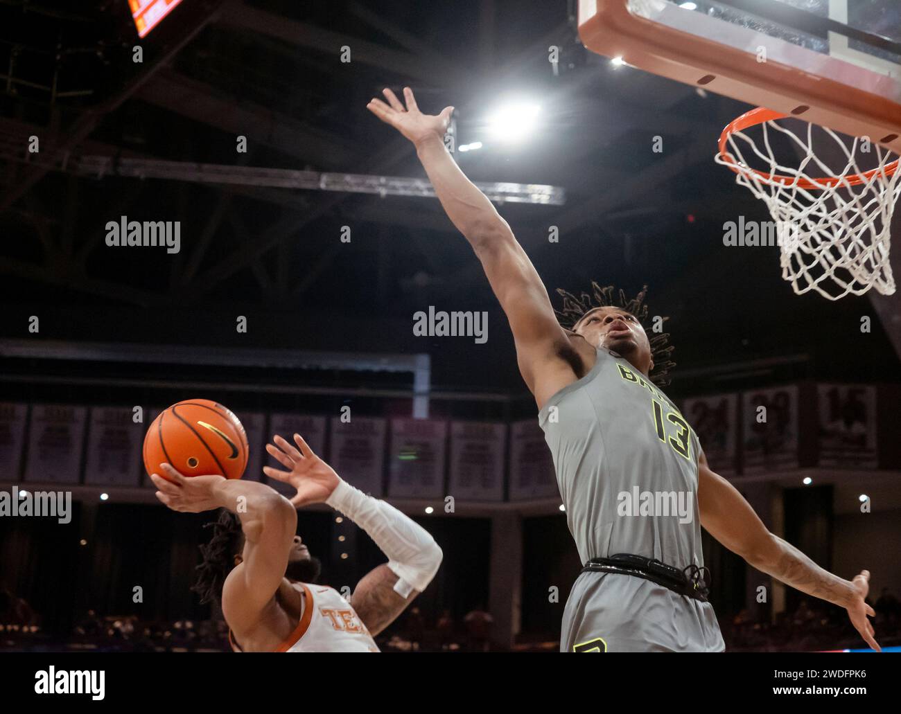 Texas guard Tyrese Hunter, left, puts up the game winning shot at the ...