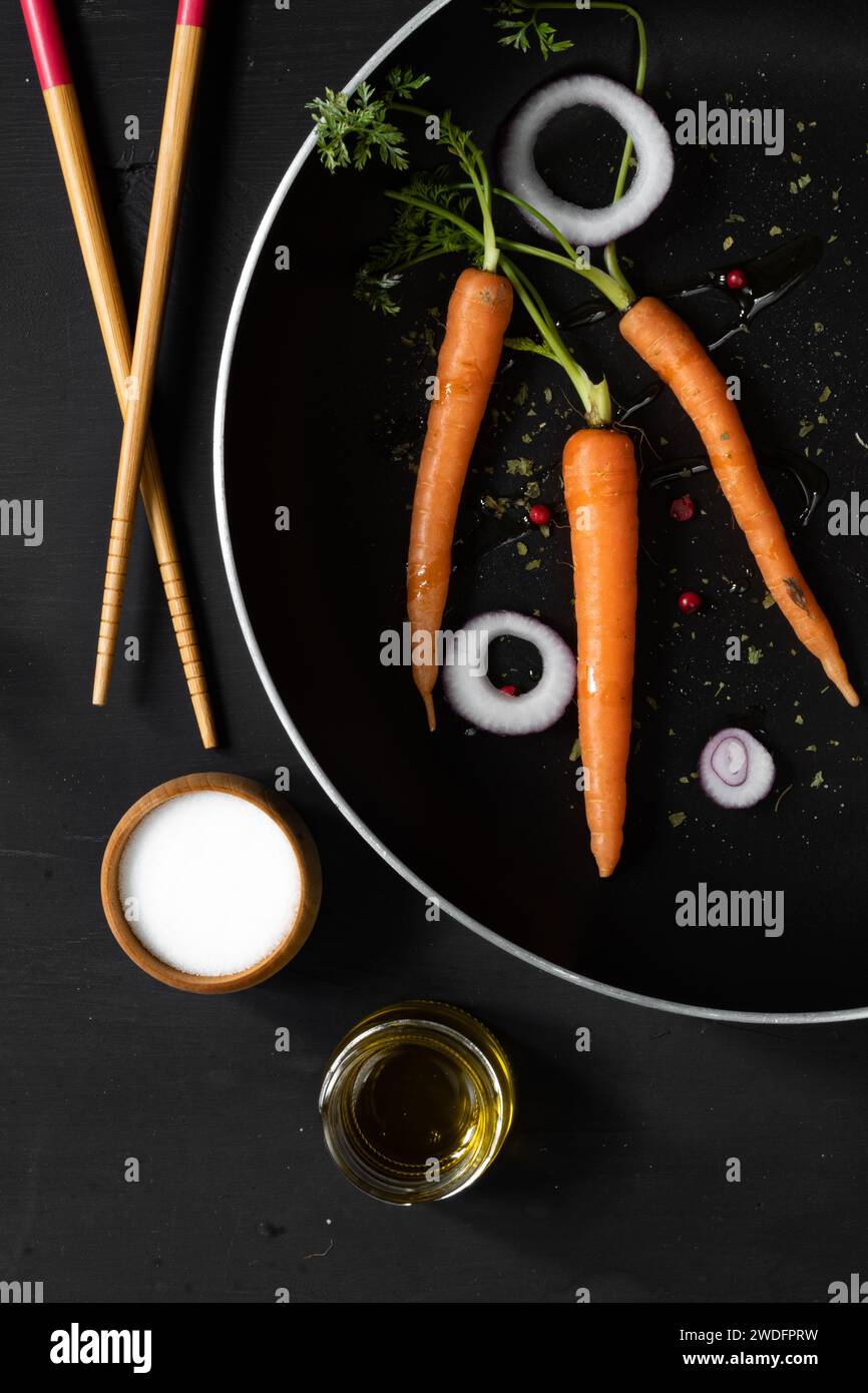 Creative carrots composition food photography Stock Photo - Alamy