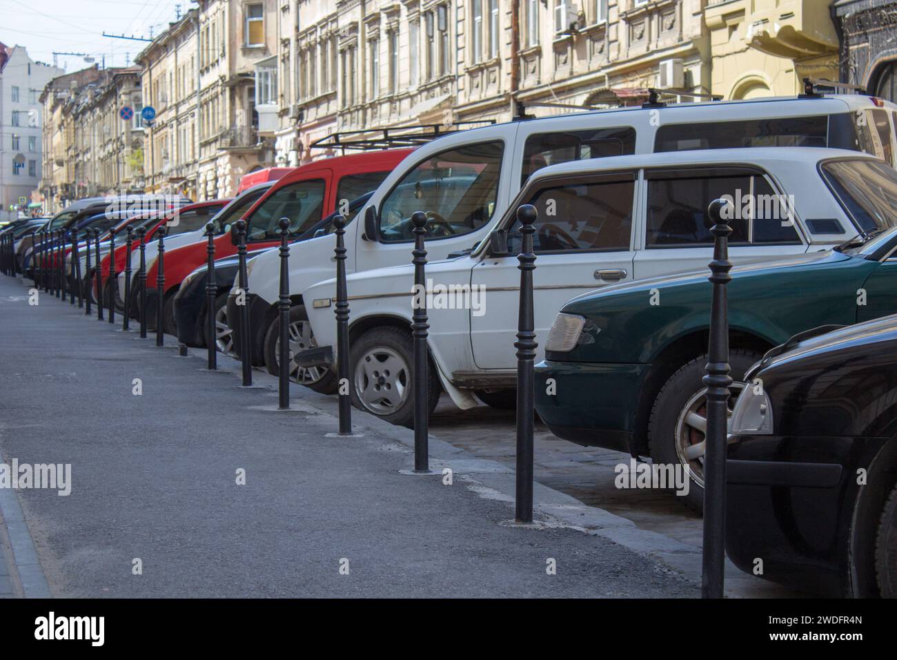 crowded street of the city by car parking along the street Stock Photo ...