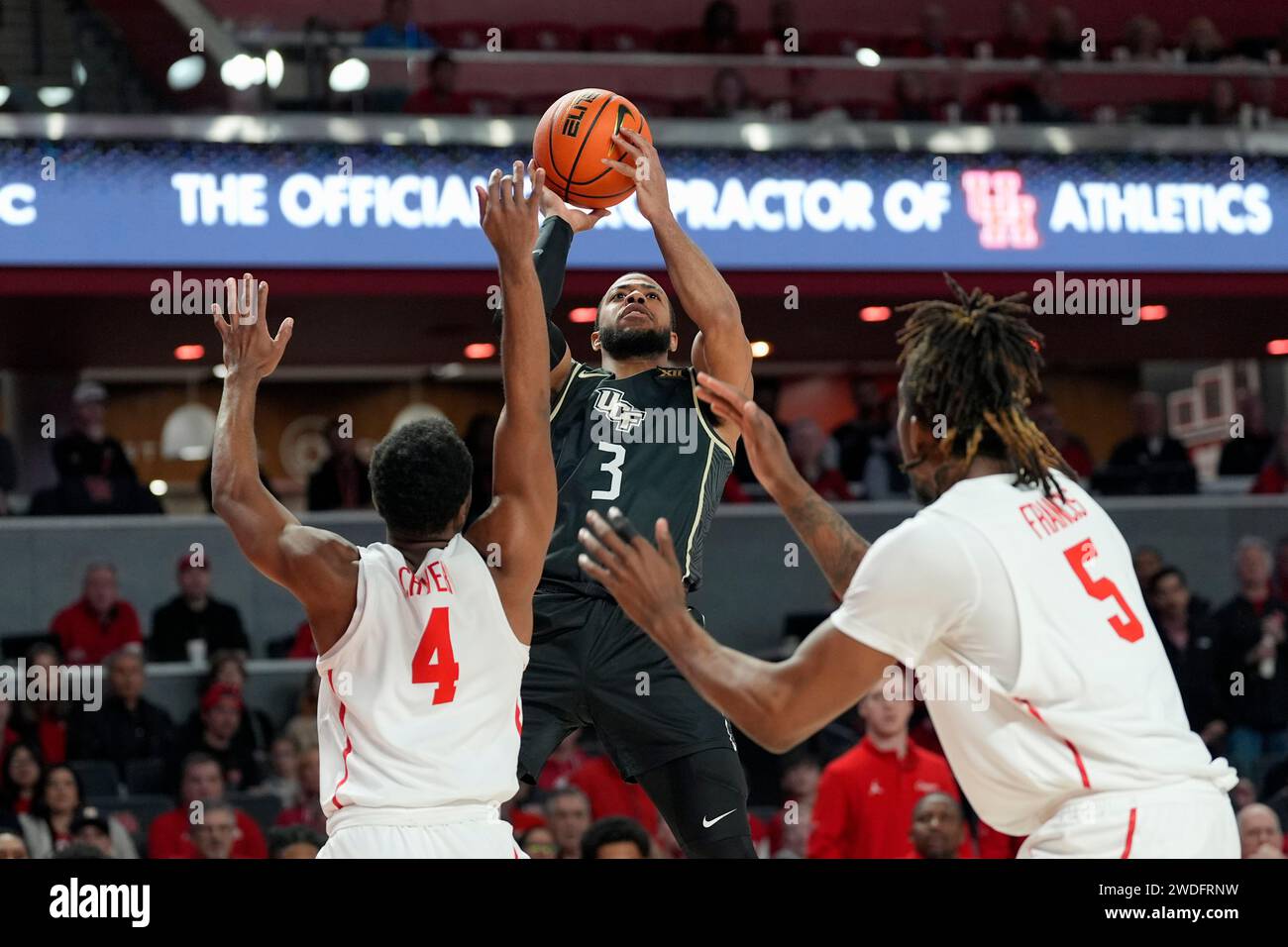 Central Florida's Darius Johnson (3) shoots as Houston's L.J. Cryer (4 ...