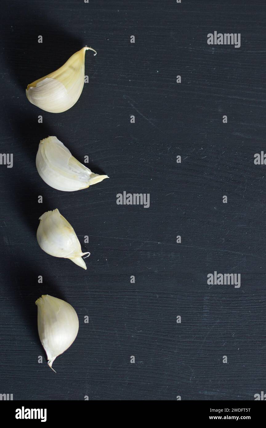 White garlic photography on black background Stock Photo - Alamy