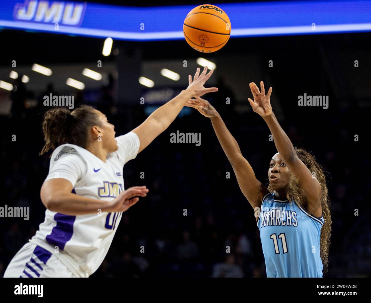 Old Dominion guard Kaye Clark (11) takes a shot against James Madison guard Peyton McDaniel (0 ...