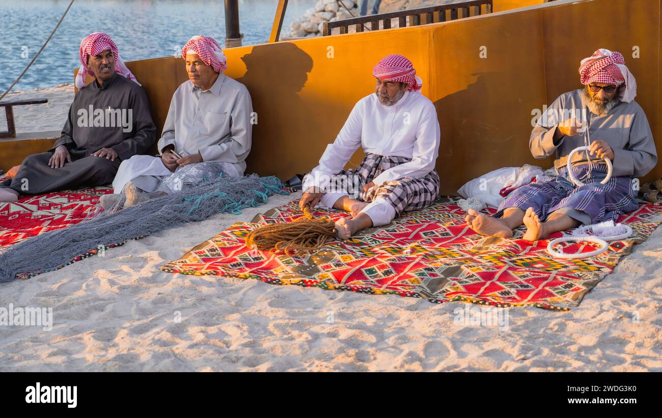 Doha,Qatar- January 10,2024 : fisherman producing fishing net at Darb ...
