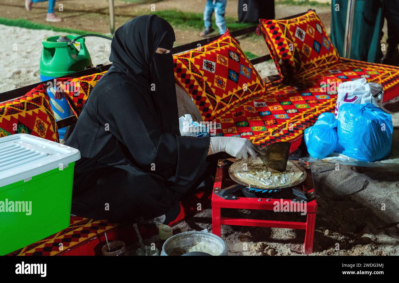 doha,qatar- january 10,2024 : arab women making crepe(Russian Blini ...