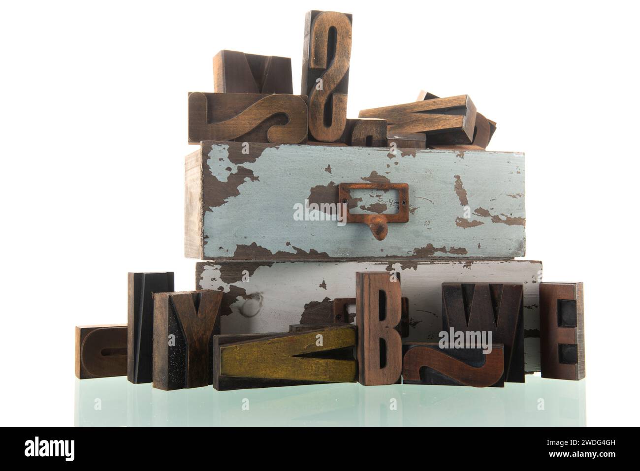 Vintage block letters in old drawers isolated over white background ...
