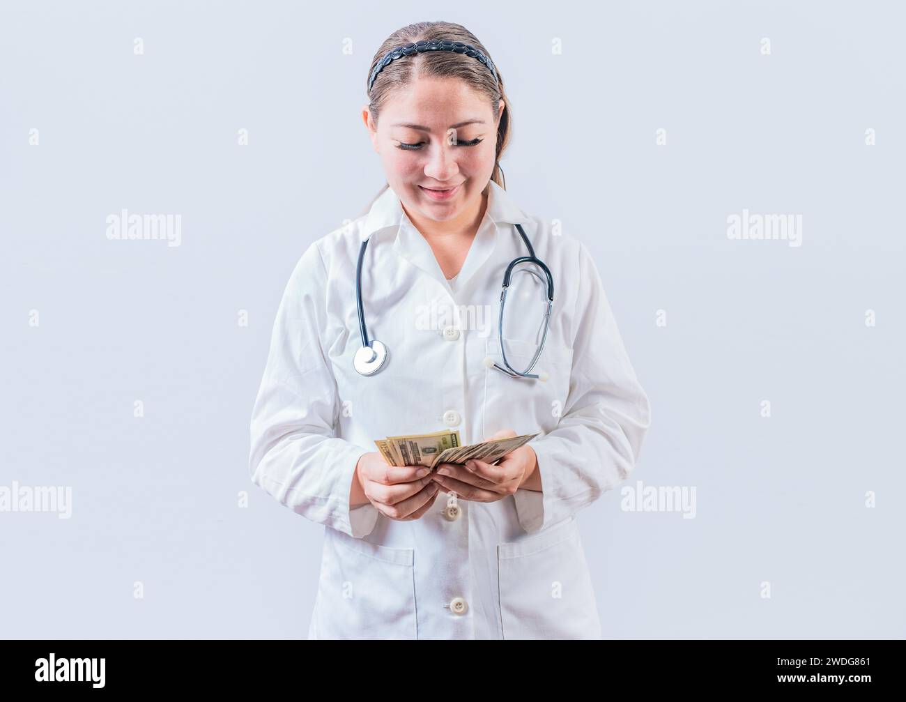 Corrupt female doctor counting money isolated. Female doctor counting ...