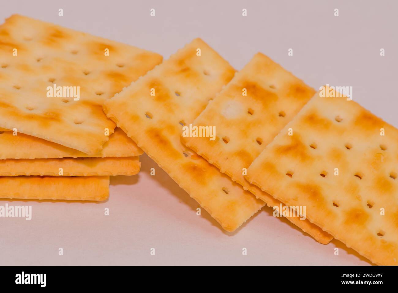 Closeup of unsalted crackers on white background Stock Photo - Alamy