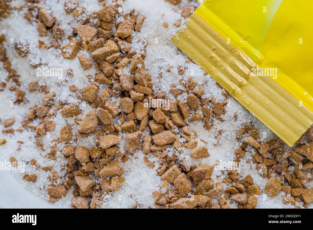 Extreme closeup of sugar and coffee granules from bag of coffee mix ...