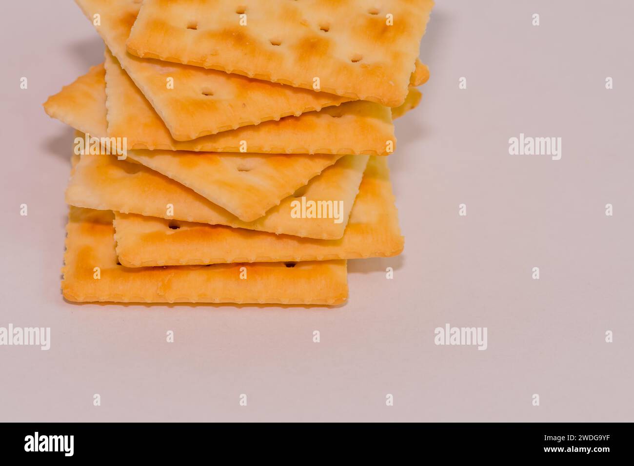 Closeup of unsalted crackers on white background Stock Photo - Alamy