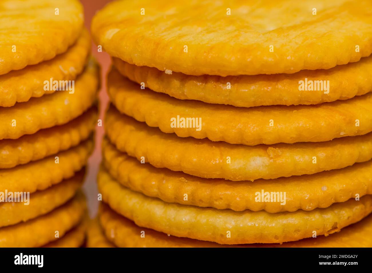 Closeup side view of two stacks of round butter crackers Stock Photo ...