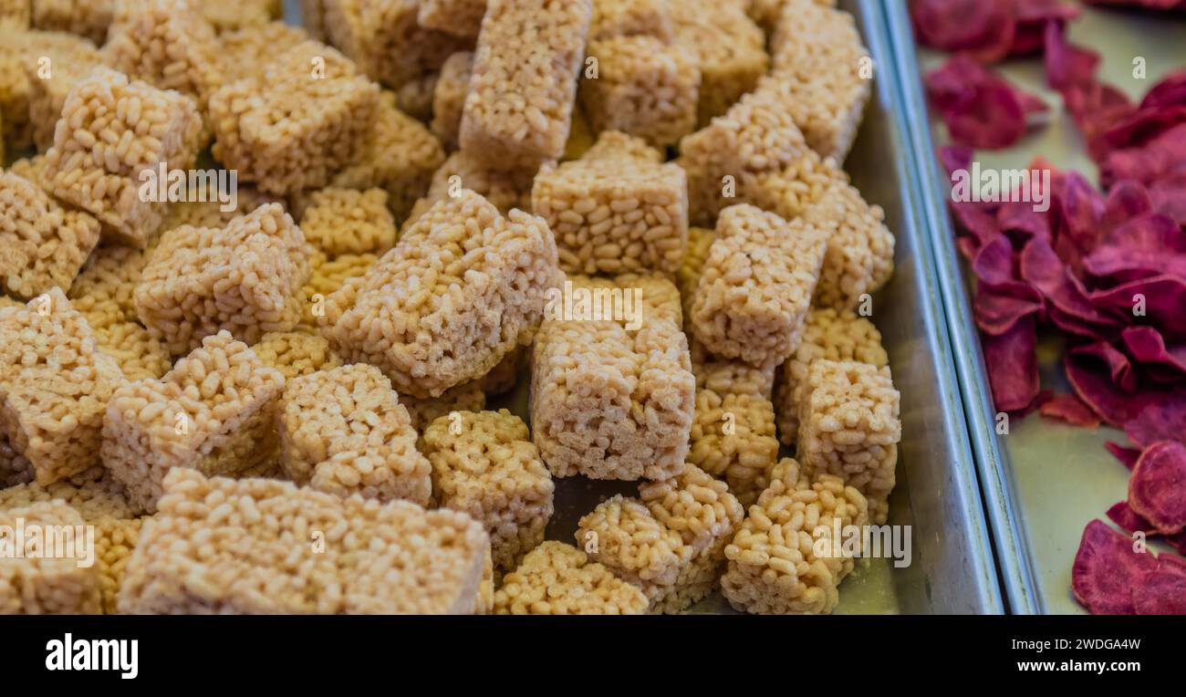 Closeup of crispy traditional Korean crispy rice snack on metal pan for ...