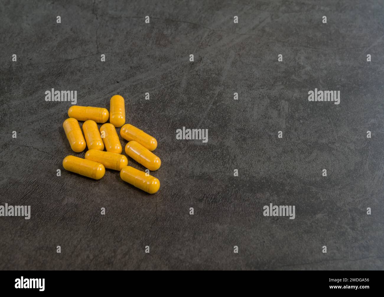 Vitamin B tablets isolated on black textured background Stock Photo - Alamy