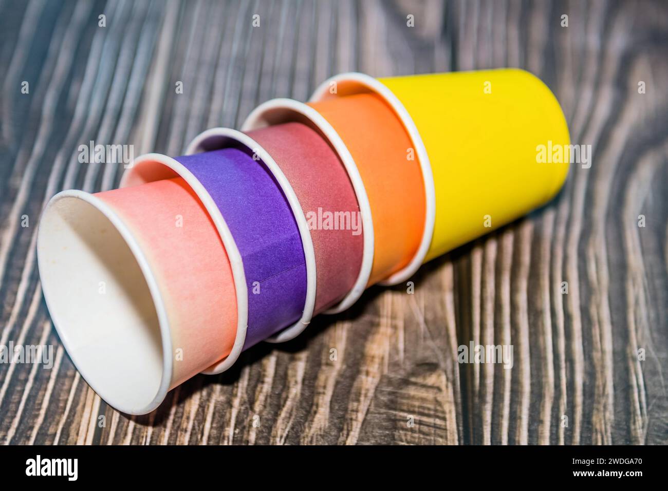 Collection of colorful paper cups on wood grain background Stock Photo ...