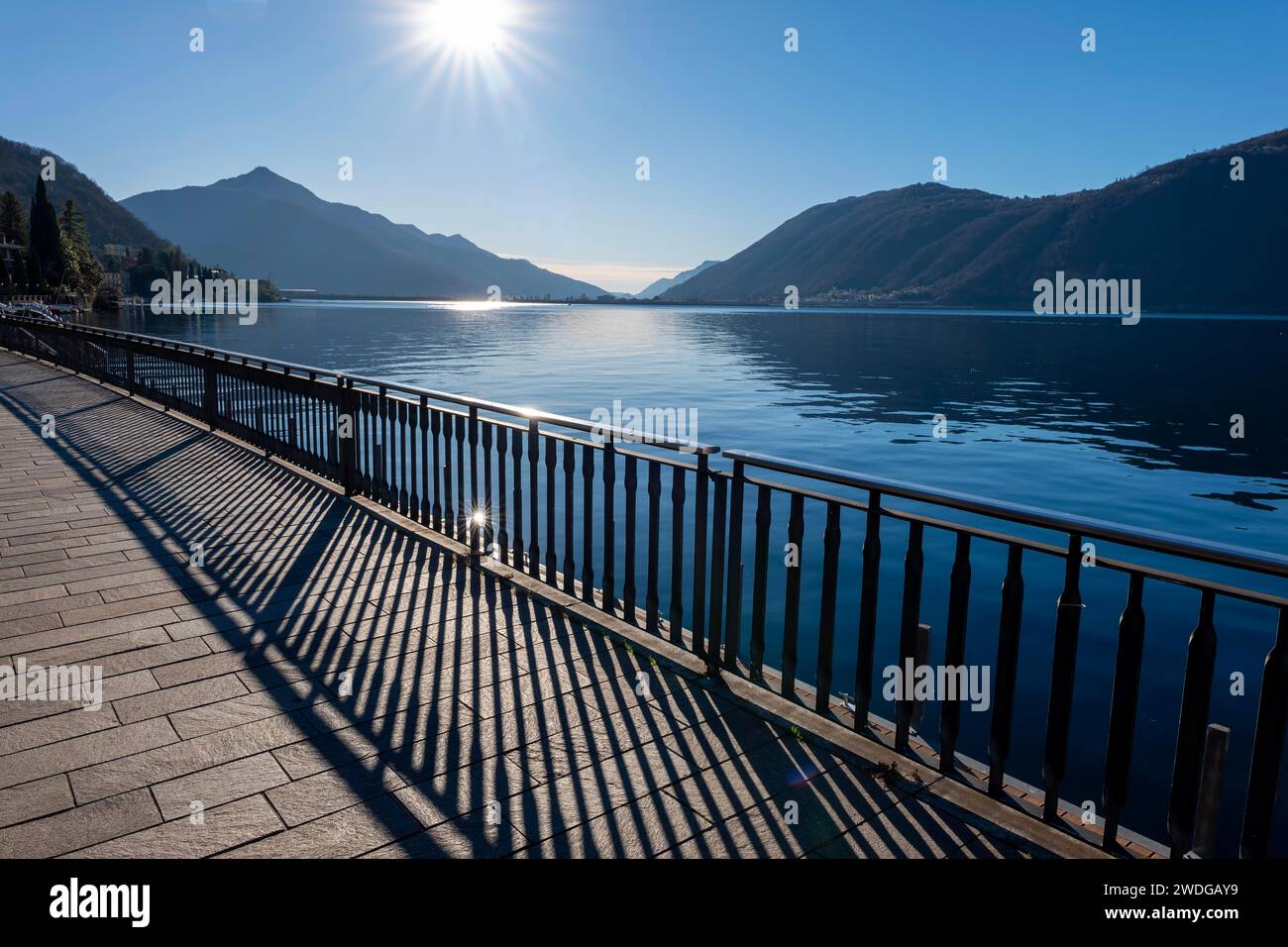 Shadow of a Railing on the Street on the Waterfront to Lake Ceresio ...
