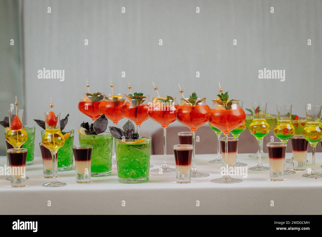 Welcome drink with cocktail glasses and drinks at an event. Alcoholic ...