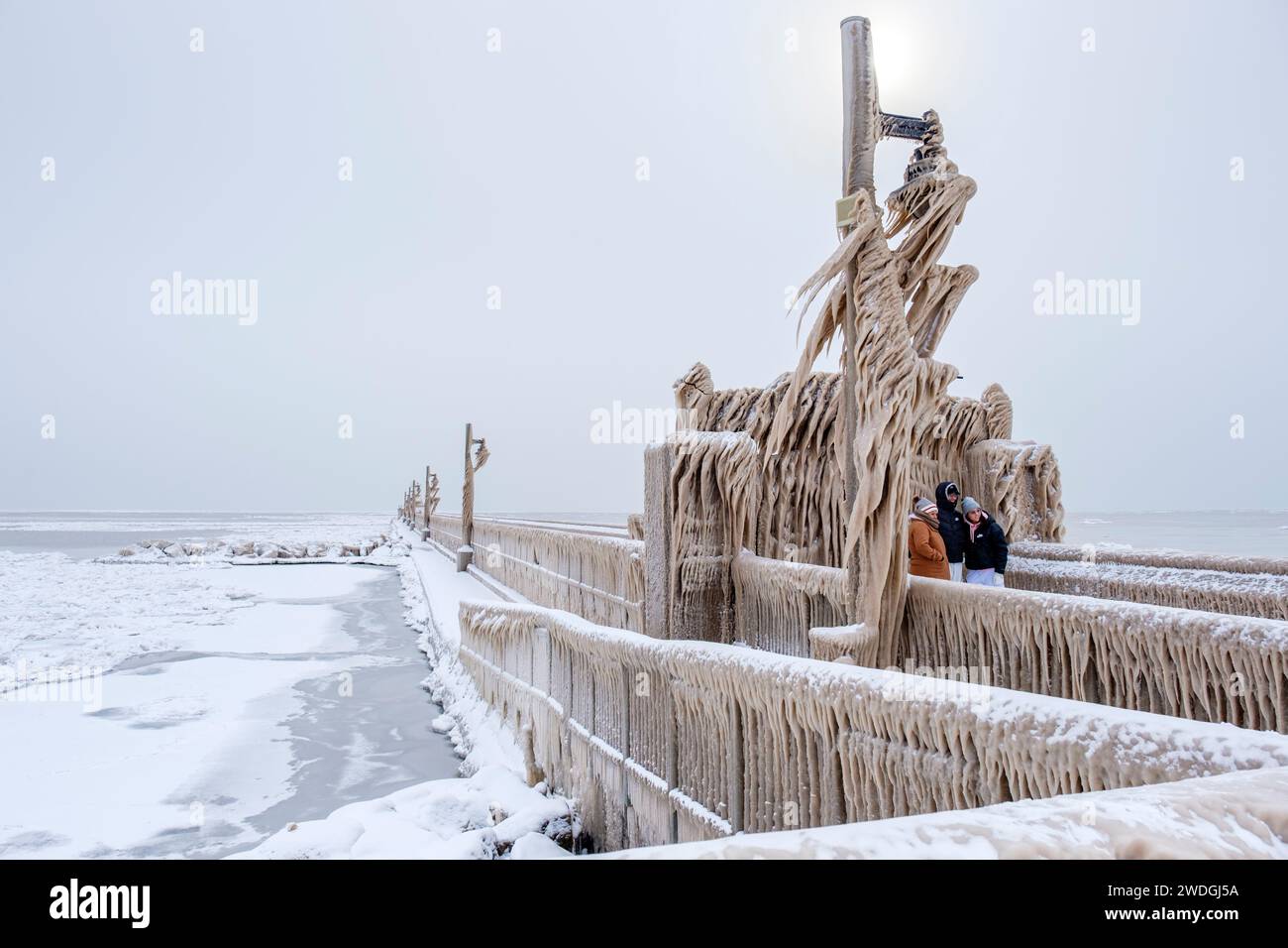 Winter wonderland, people taking photos of frozen icicles, Lake Erie ...