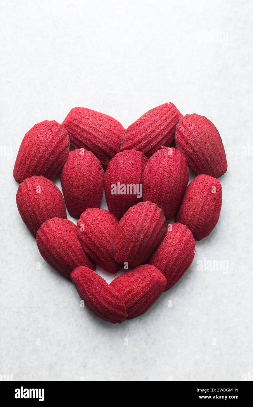Red velvet madeleines on a marble tray shaped like a heart, red ...