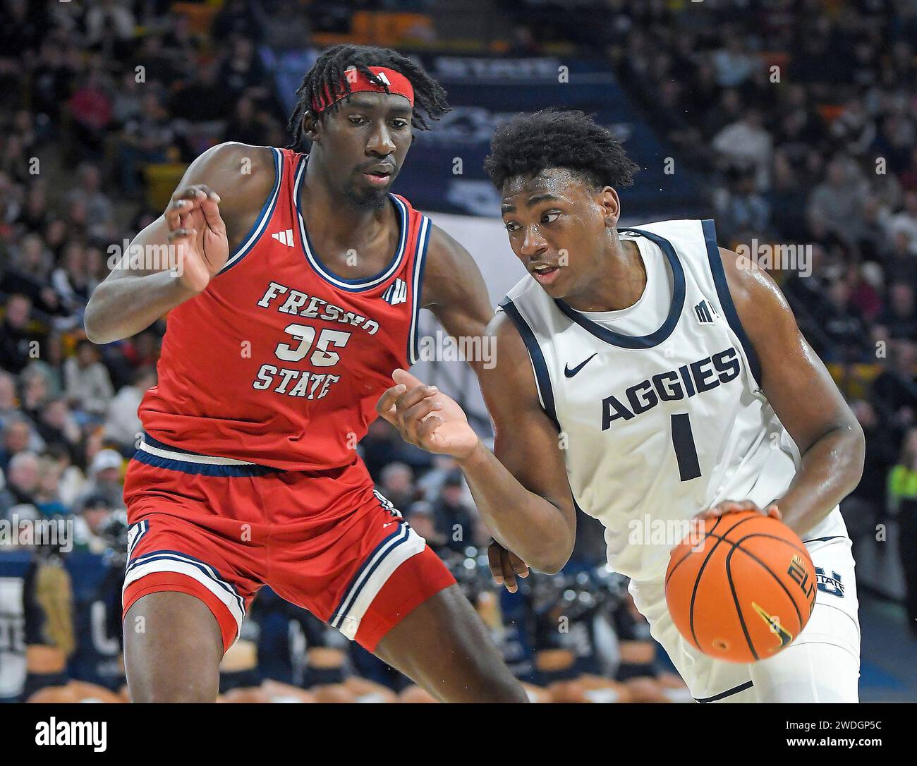Utah State forward Great Osobor (1) dribbles the ball as Fresno State ...