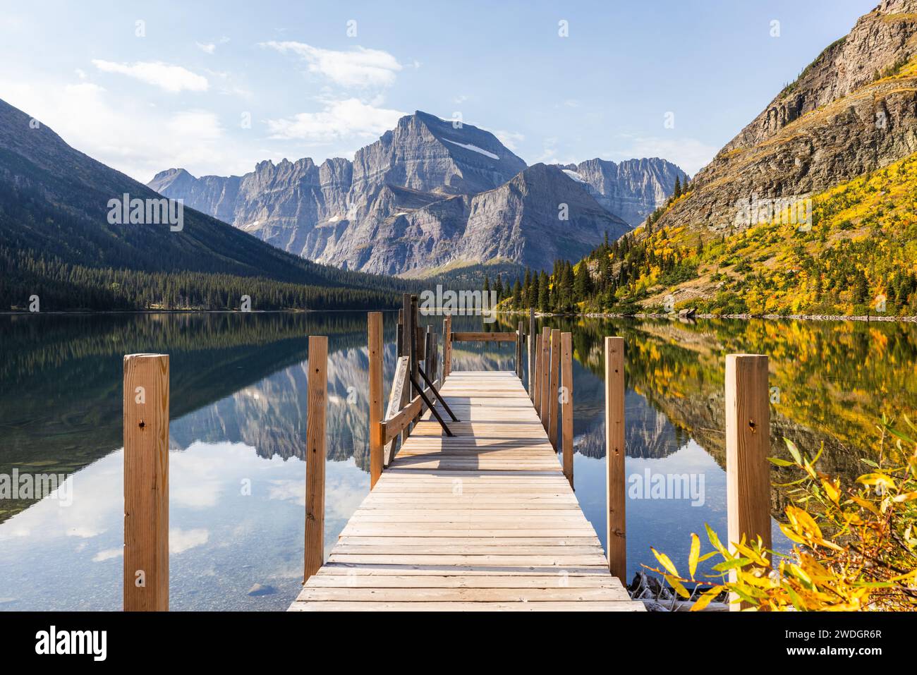 Lake Josephine reflecting the beautiful steep mountains of Glacier ...