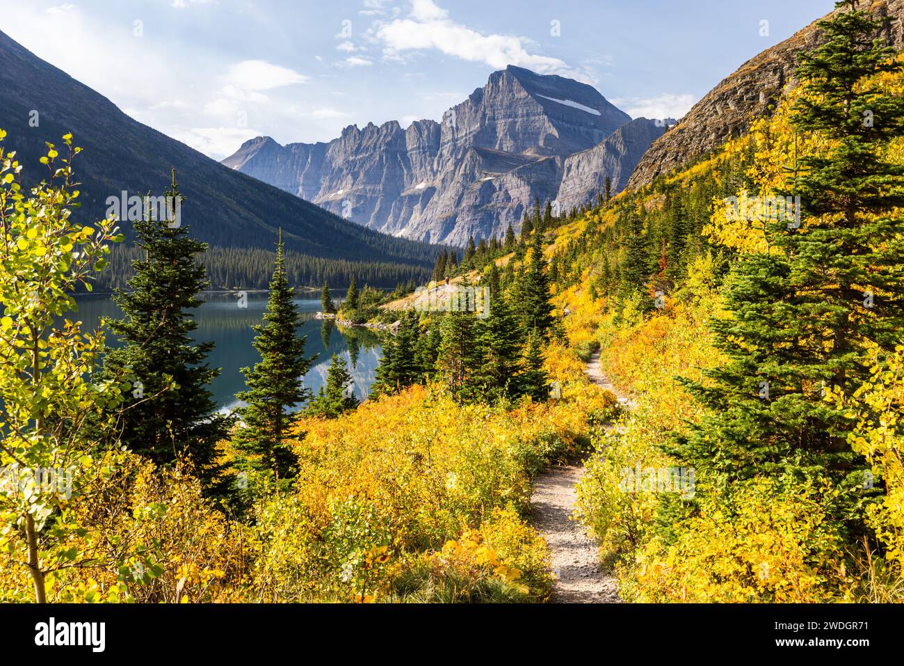 Hike to Grinnell Glacier in Montana during fall with Lake Josephine in ...