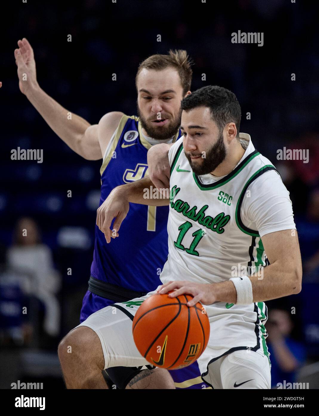 James Madison guard Noah Freidel (1) fouls Marshall guard Kamdyn ...