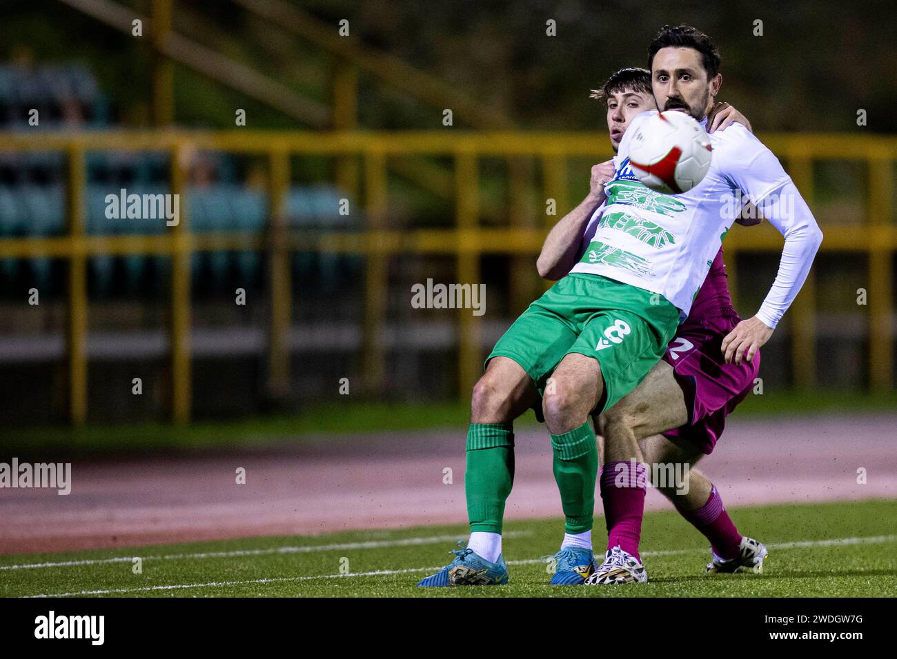 Barry, UK. 20th Jan, 2024. Ryan Brobbel of TNS in action against Kian ...