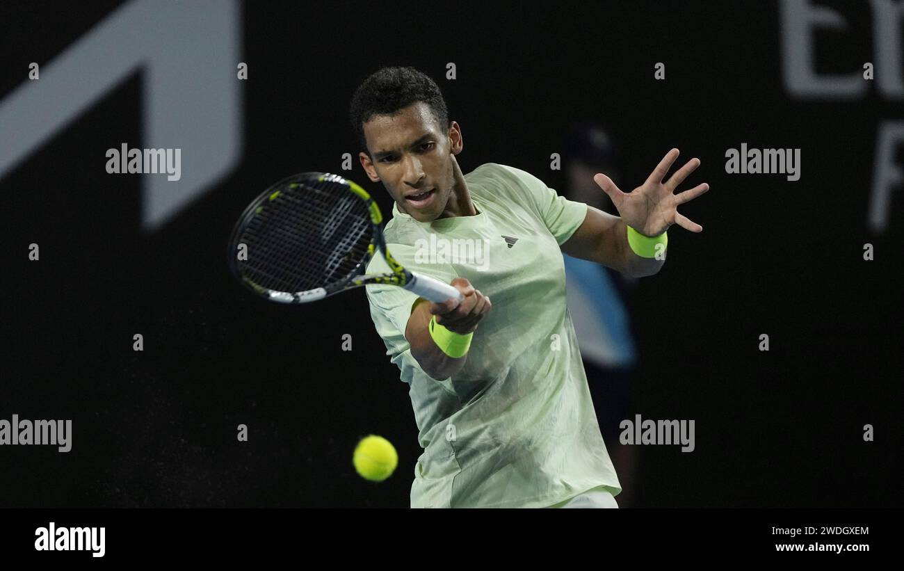 Felix Auger-Aliassime of Canada plays a forehand return to Hugo Grenier of France during their ...